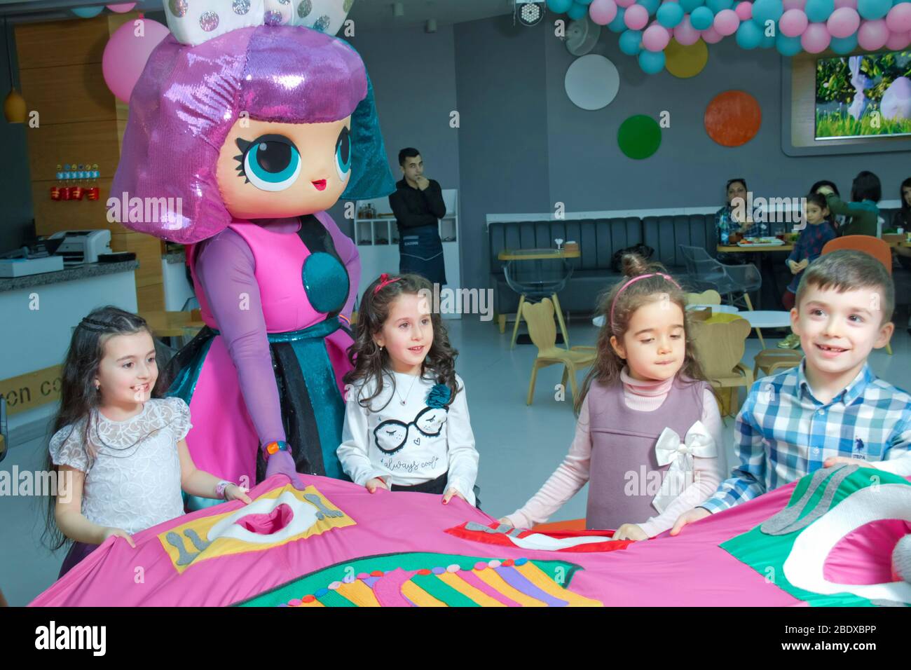 Children's birthday party with Lol animators. Happy group of children ...