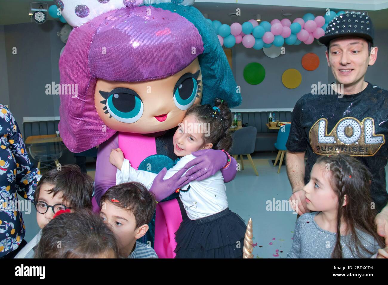 Children's birthday party with Lol animators. Happy group of children ...