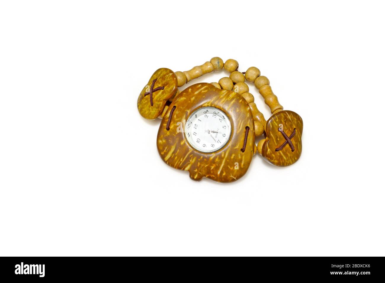 closeup of coconut shell watch on a white background Stock Photo - Alamy