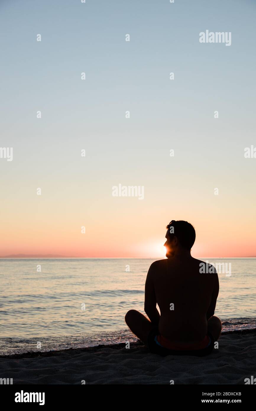 Lonely man watching sunset on hi-res stock photography and images - Alamy
