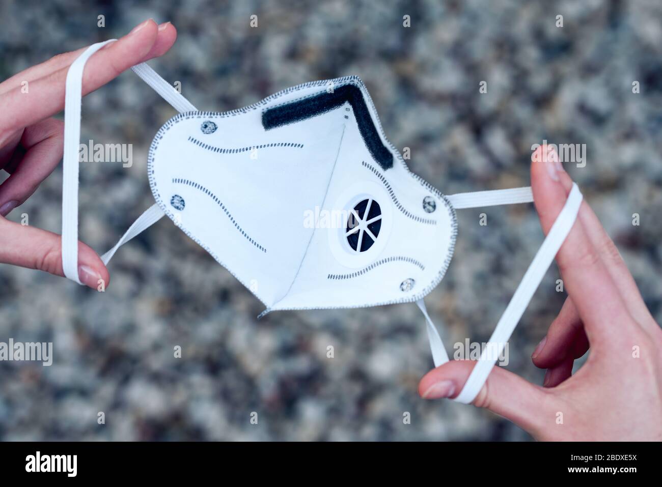 Anti-smog, anti-virus mask put on outside to protect against ...