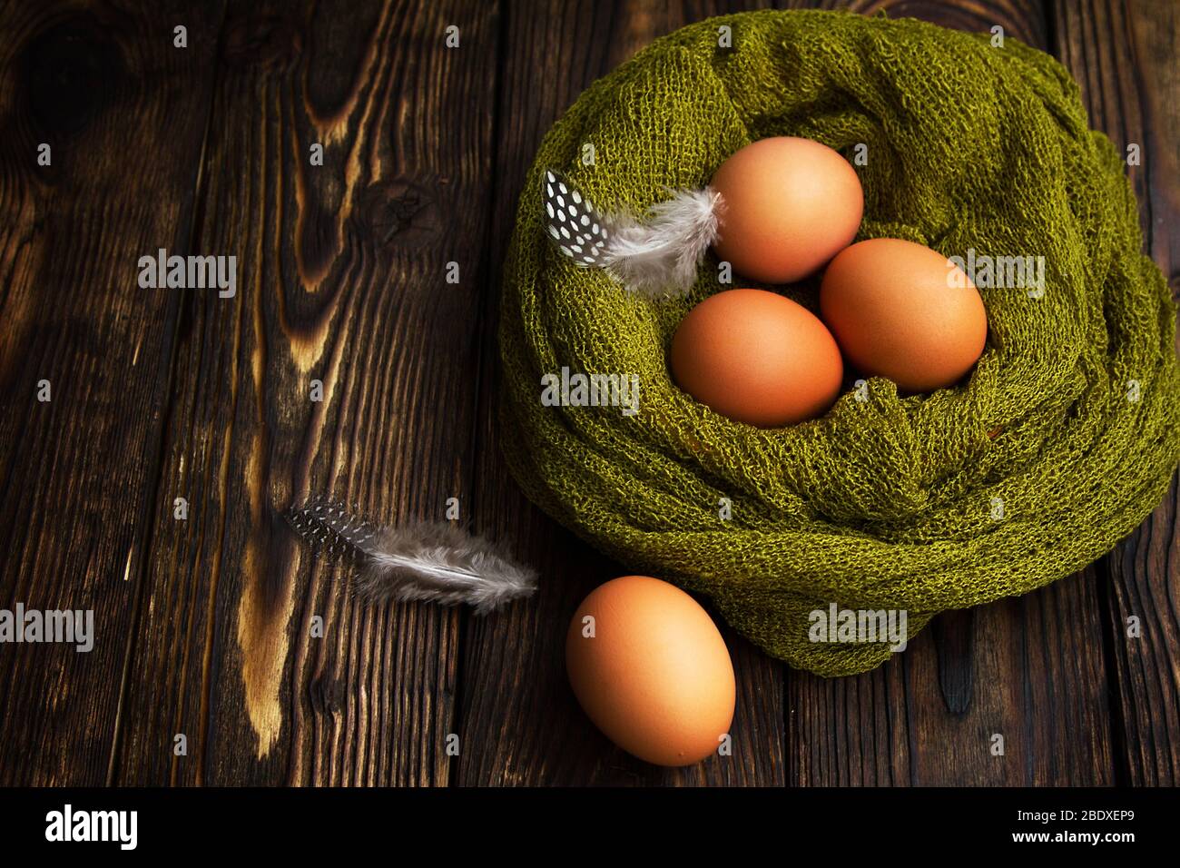 natural eggs in green nest woven on wooden background with space Stock ...