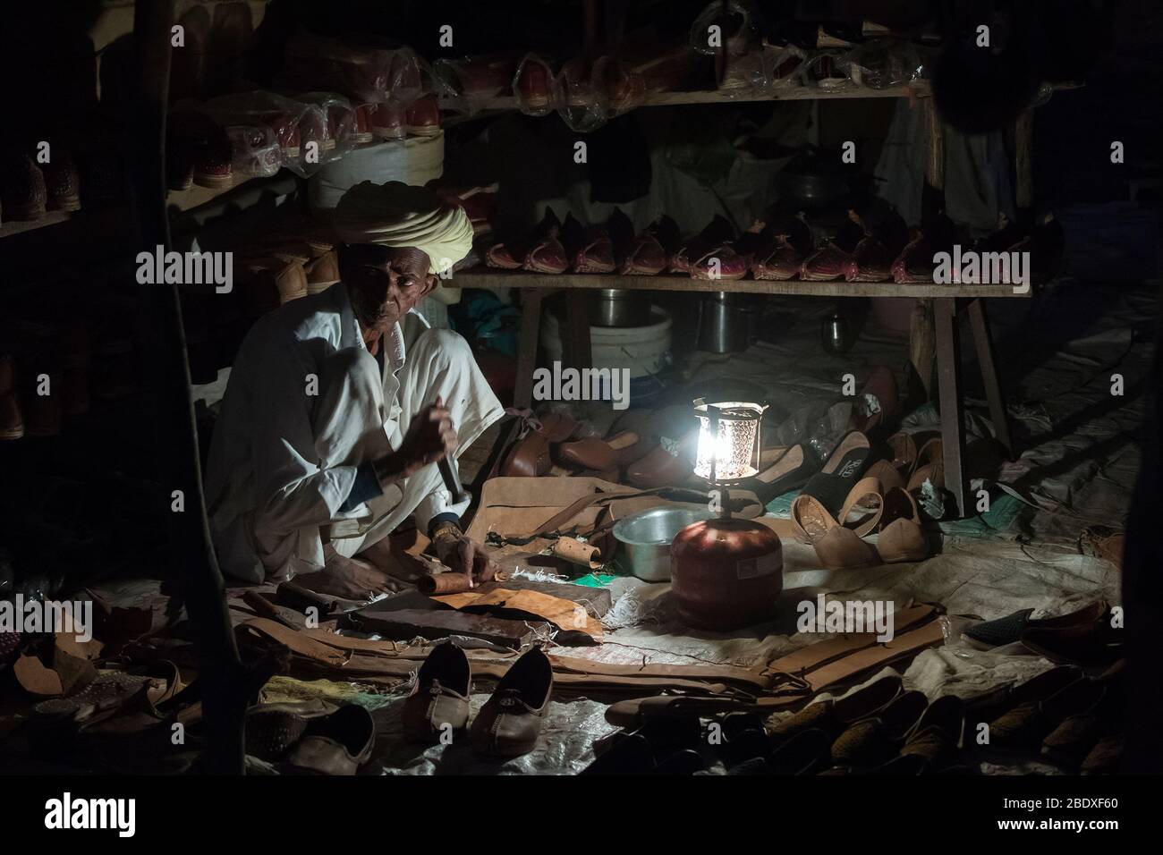 The image of Rajasthani shoe maker at Pushkar animal Fair, Ajmer ...