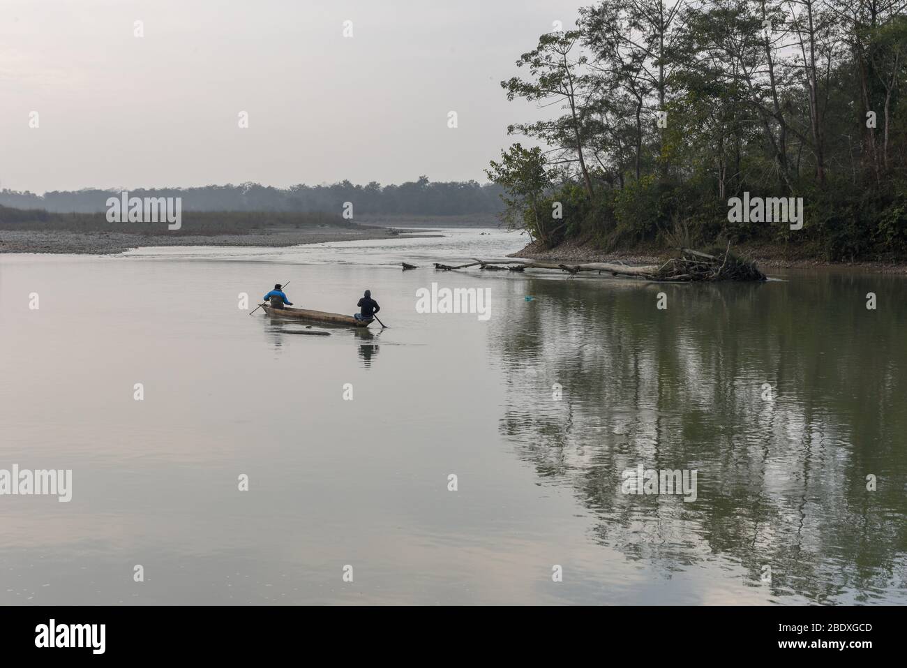 Fisherman at Rapti river of Chitwan national park on Nepal Stock Photo ...