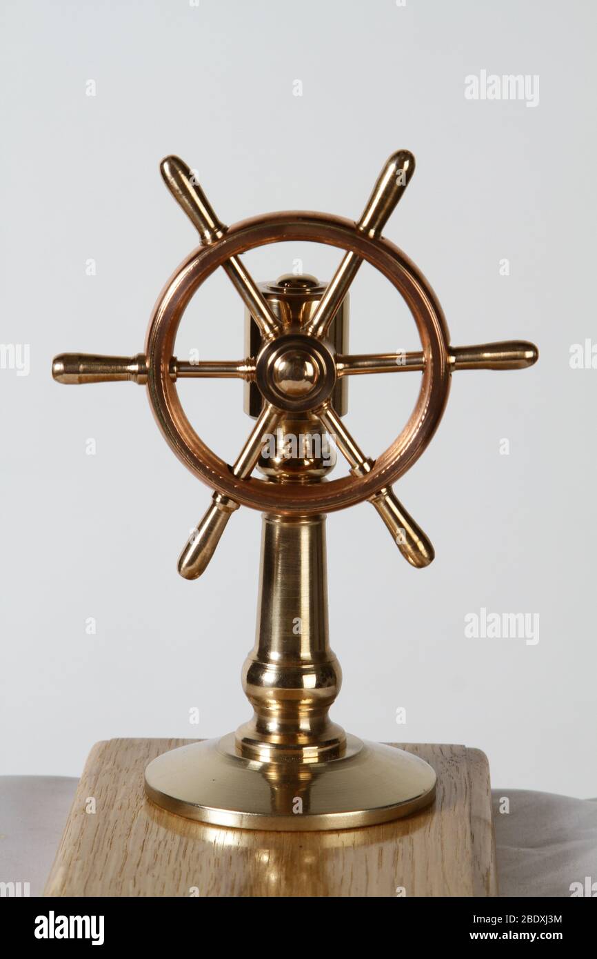 Steering wheel of the ship isolated on white Stock Photo - Alamy