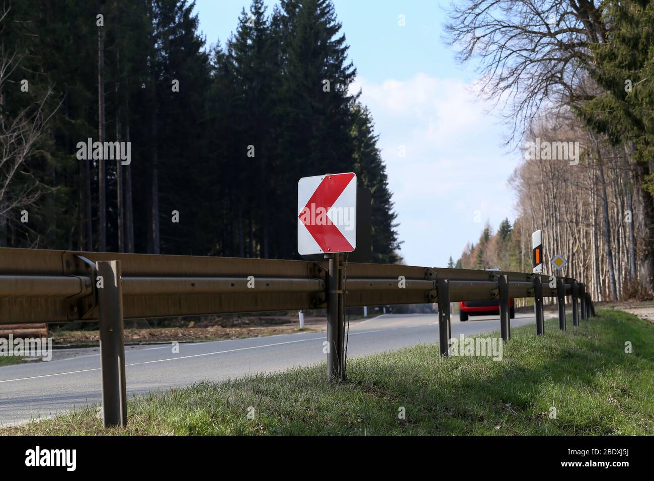 Right Turn Sign: Road signs warn of a sharp turn on a narrow road Stock ...