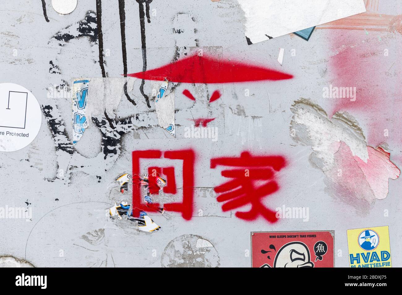 "Chinese go home"; racist stencil graffiti with racial stereotype and ...