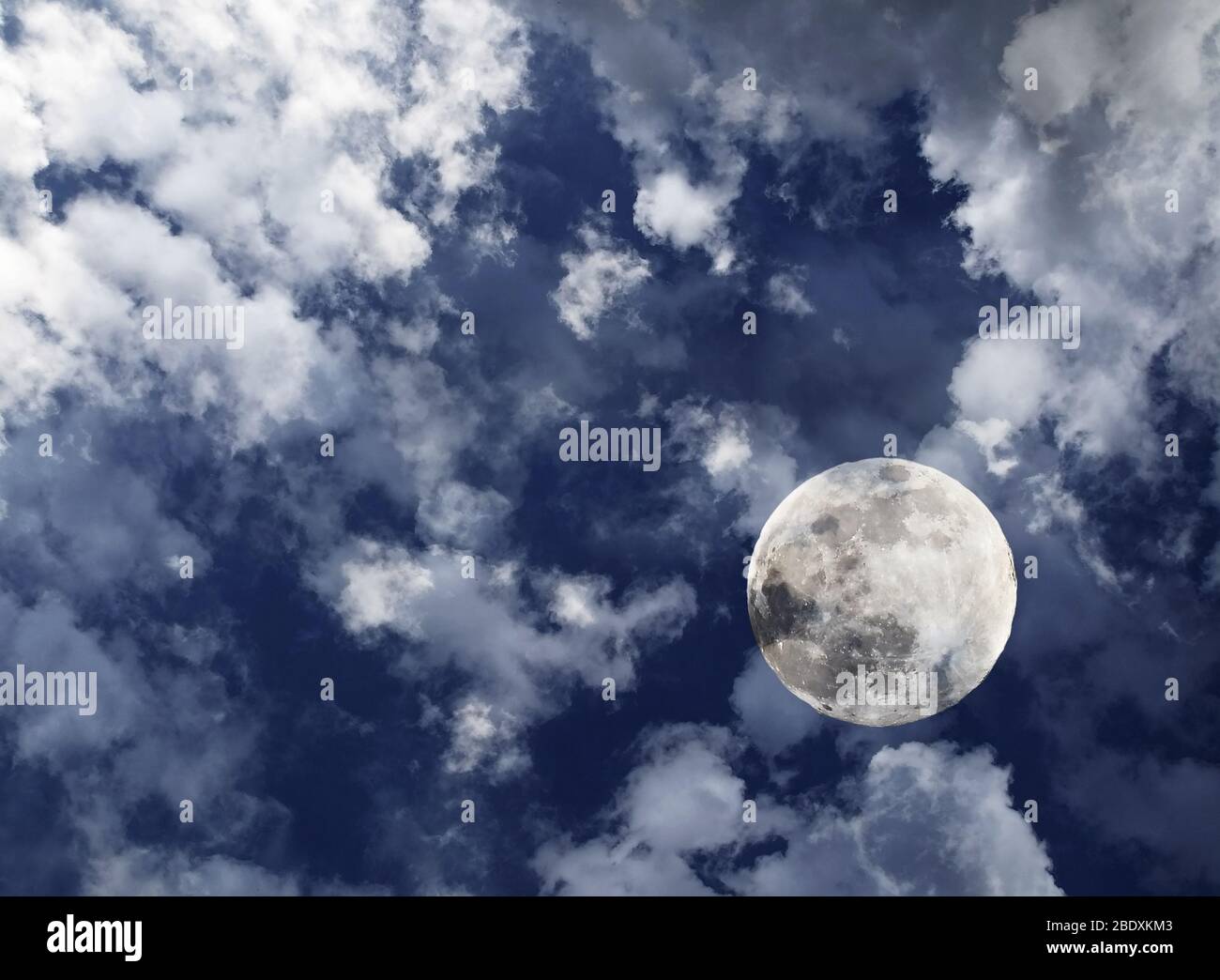 Full moon in midnight deep blue sky with clouds Stock Photo - Alamy