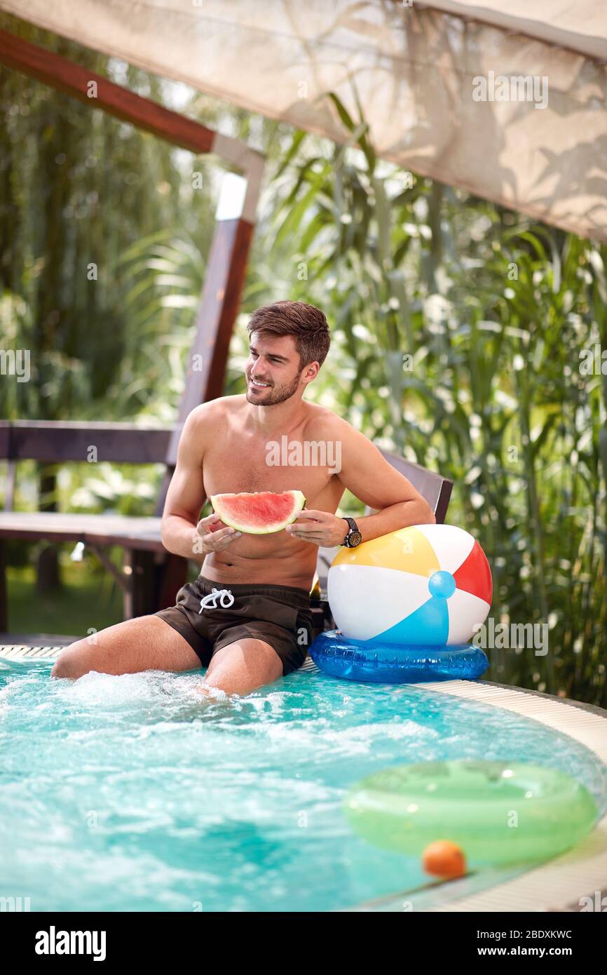 Male refreshing on swimming hi-res stock photography and images - Alamy