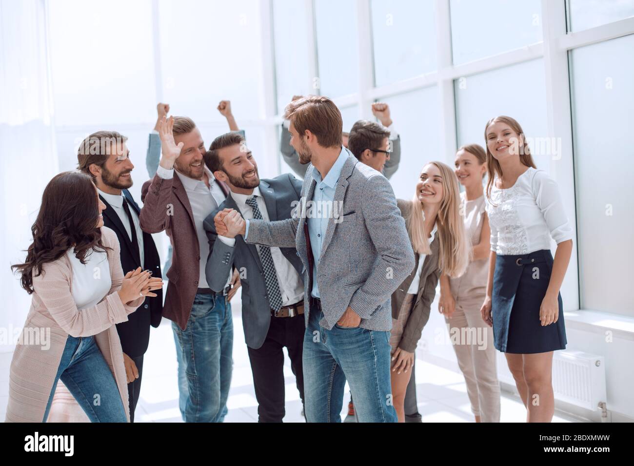 young business man accepting congratulations from his colleagues Stock ...