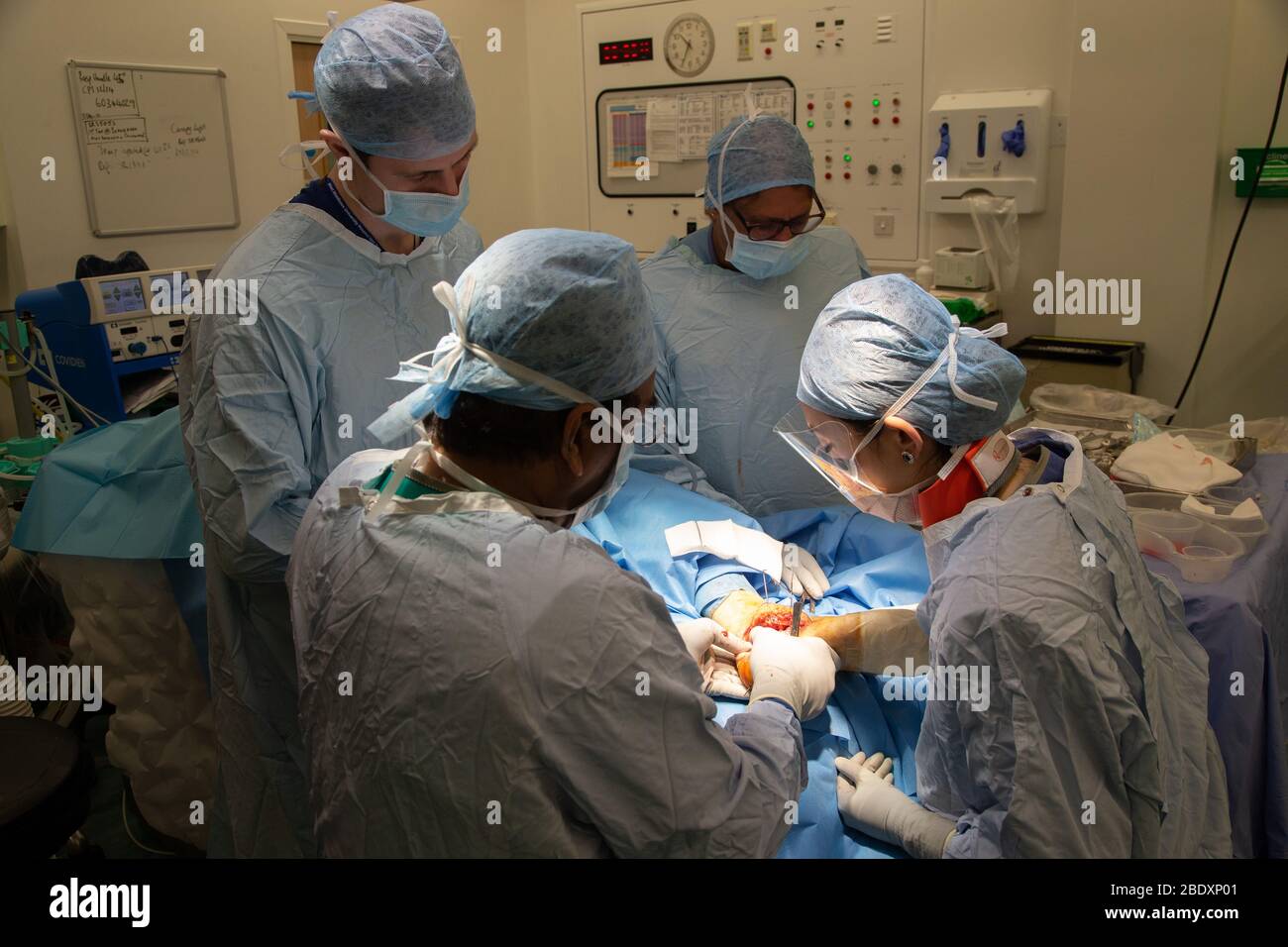 NHS surgeons and nurses perform surgery in an NHS Hospital.The ...
