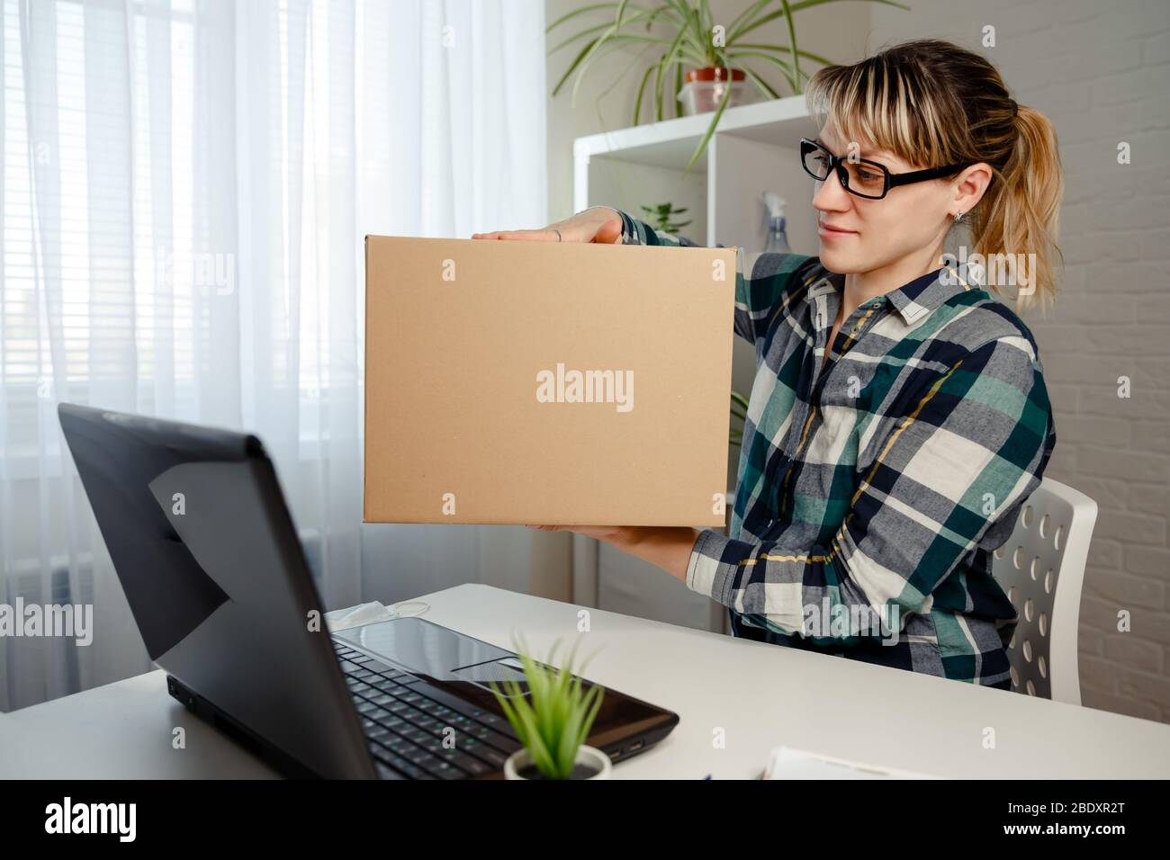 Online shopping, ecommerce and delivery service concept. A woman works ...