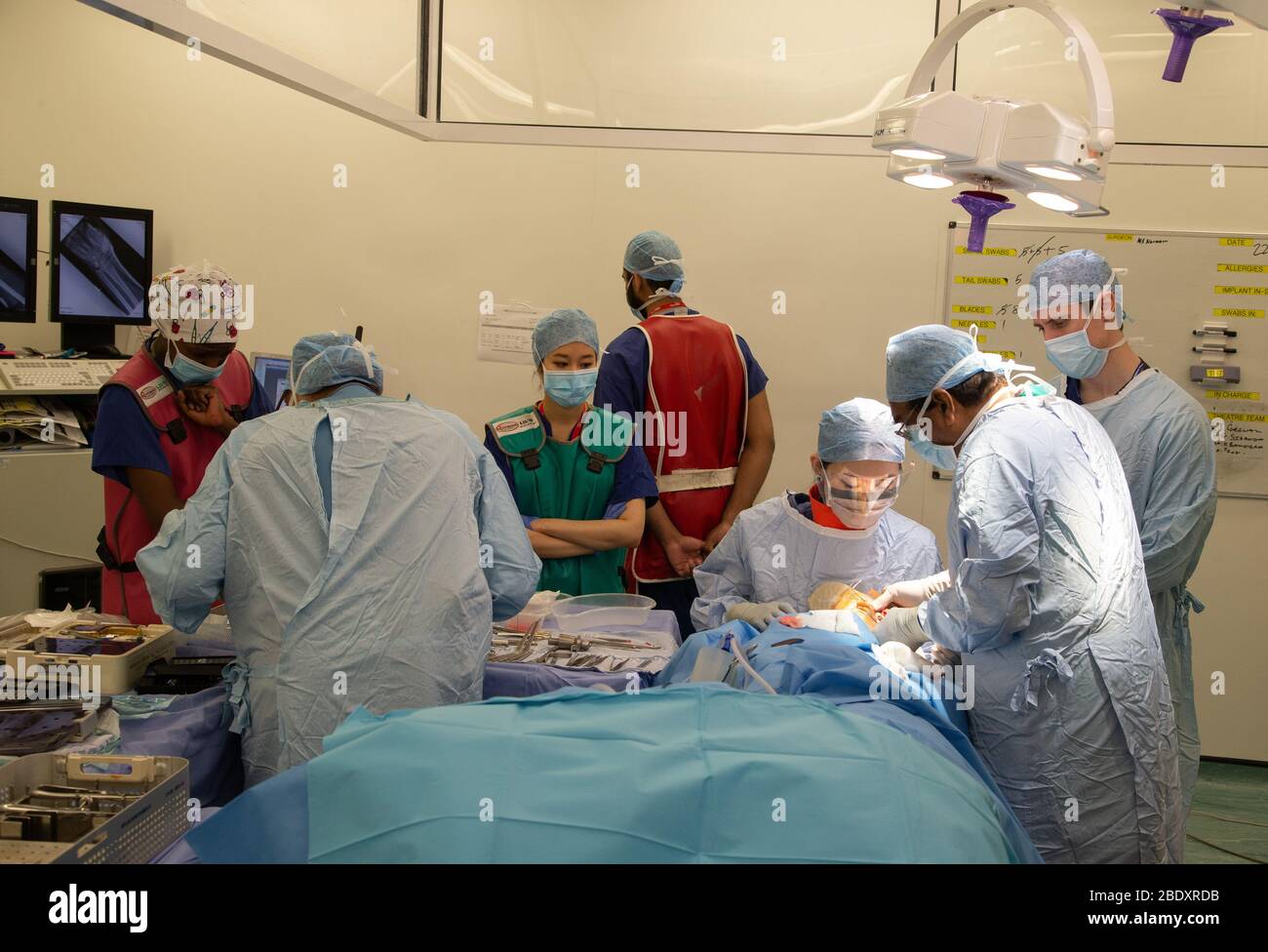 NHS surgeons and nurses perform surgery in an NHS Hospital.The ...