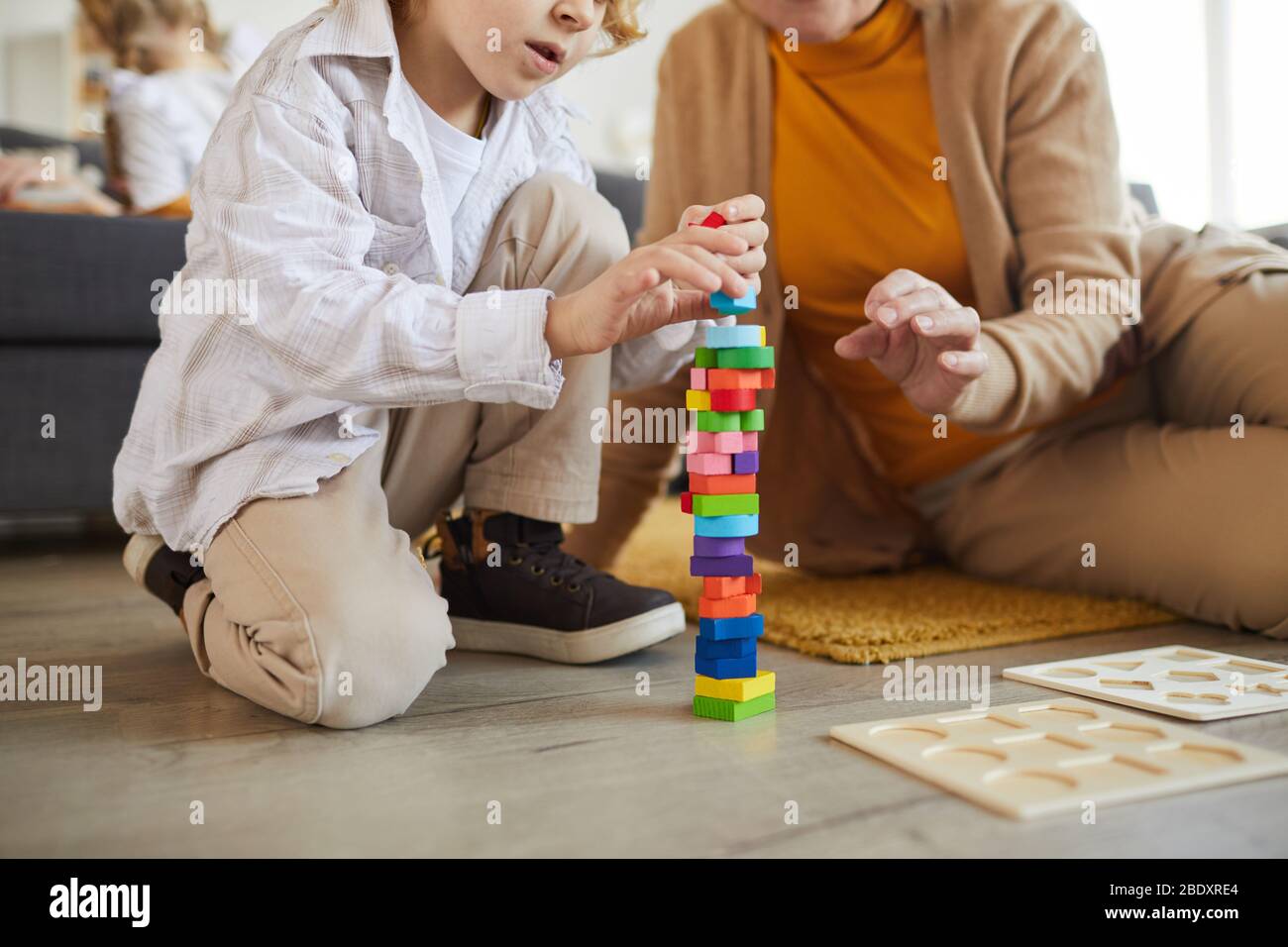 Two boys block tower building hi-res stock photography and images - Alamy