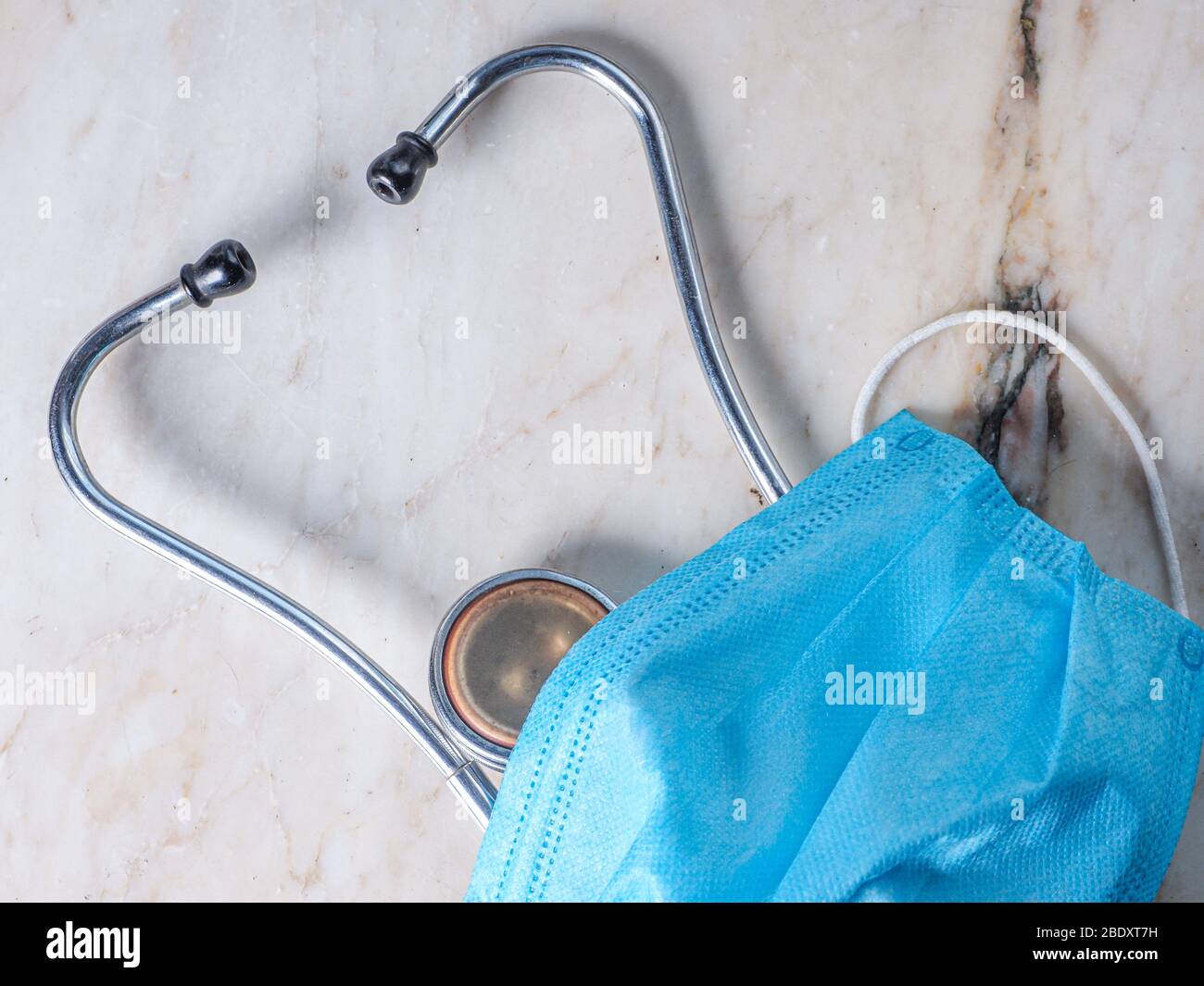 Coronavirus, stethoscope, surgical mask, pills on a black white ...