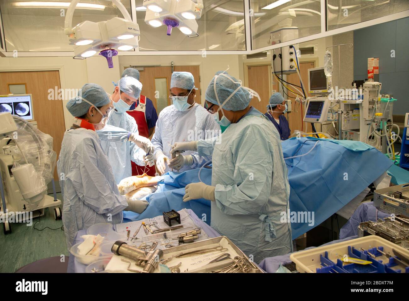 NHS surgeons and nurses perform surgery in an NHS Hospital.The ...