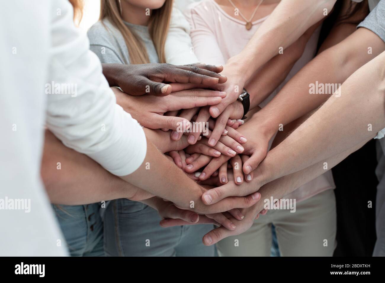 close up. diverse young people showing their unity Stock Photo - Alamy