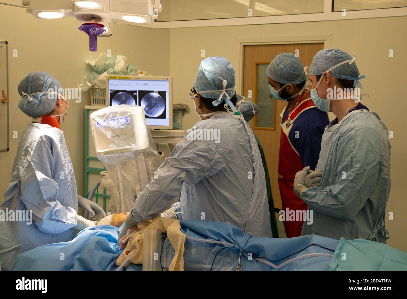 Nhs staff check a scan on an x ray machine hi-res stock photography and ...