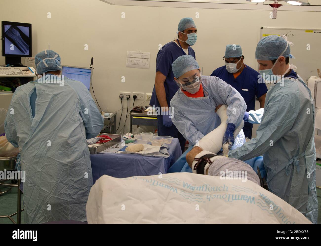 NHS surgeons and nurses perform surgery in an NHS Hospital.The ...