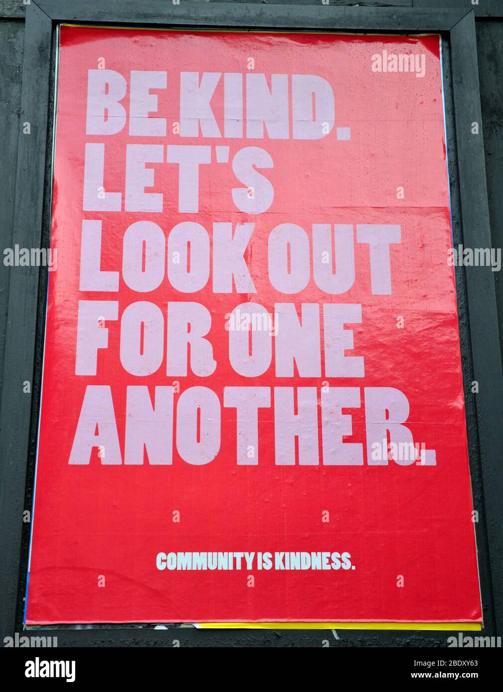 A poster saying: Be kind. Let's look out for one another' in city ...