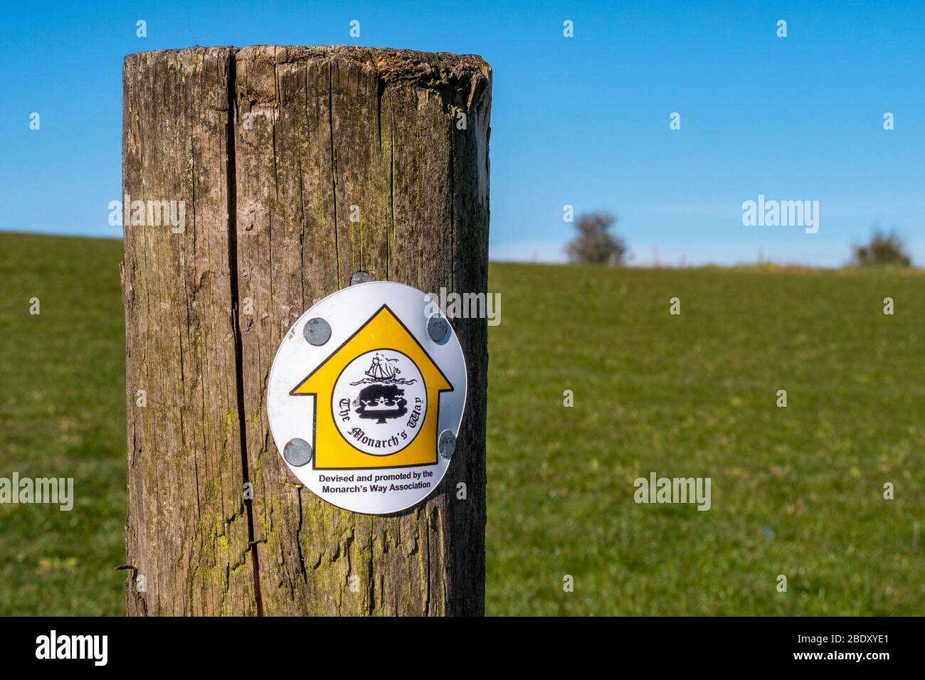 A Monarch's Way waymarker post and signage on Church Hill near Findon ...