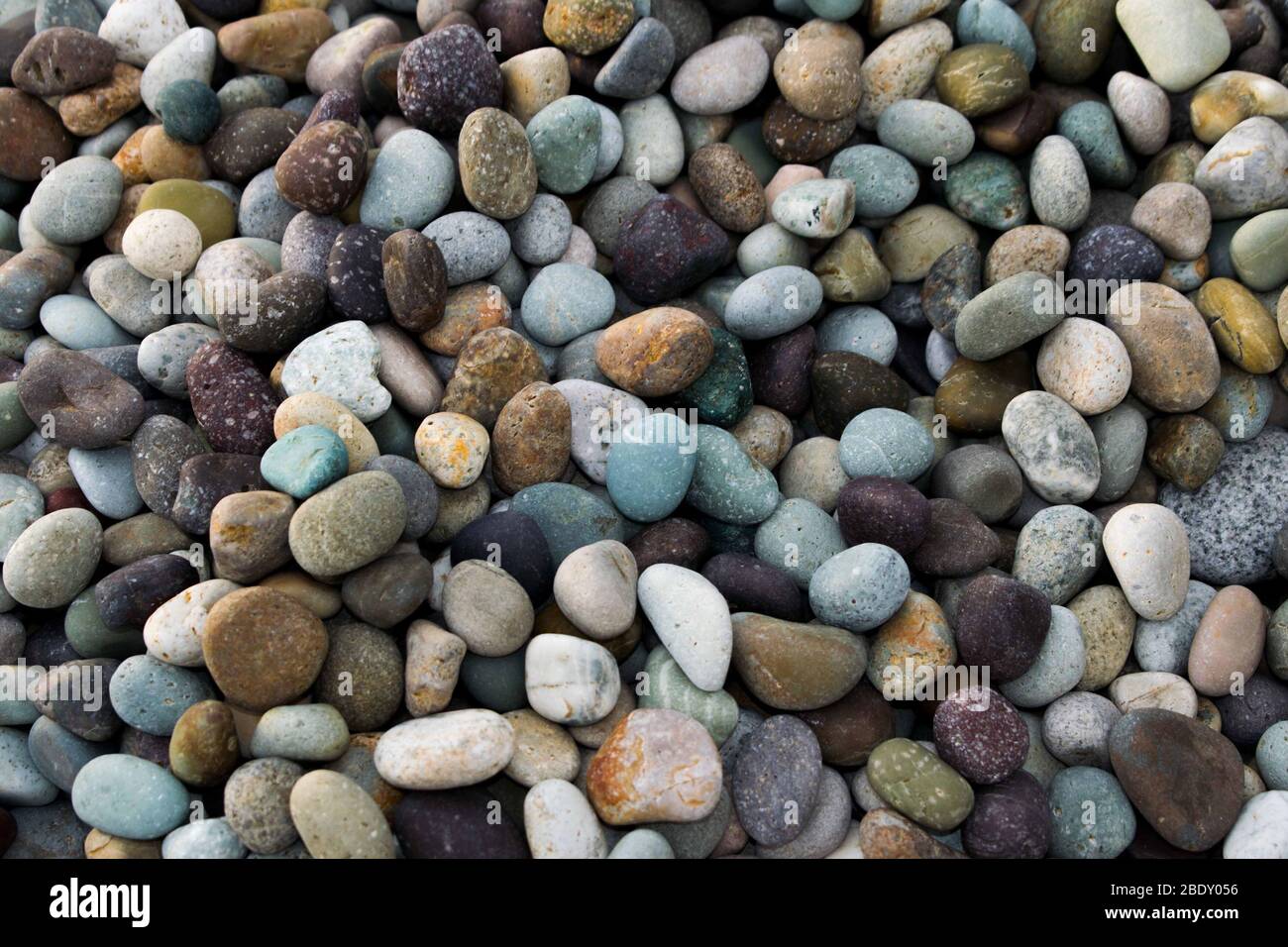 Multi-colored pebblestones on a pile Stock Photo - Alamy
