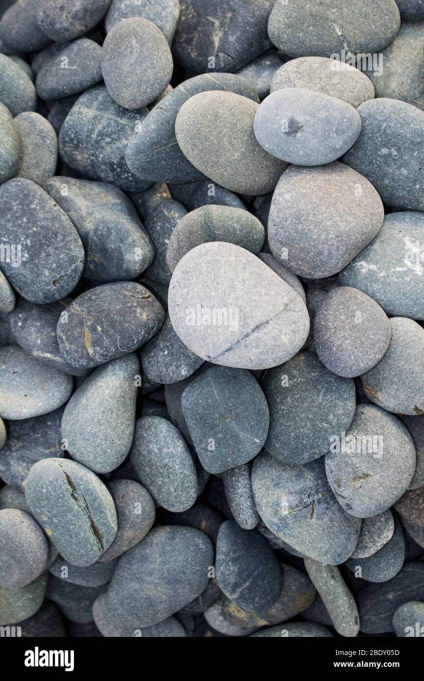 Smooth gray beach pebbles Stock Photo - Alamy