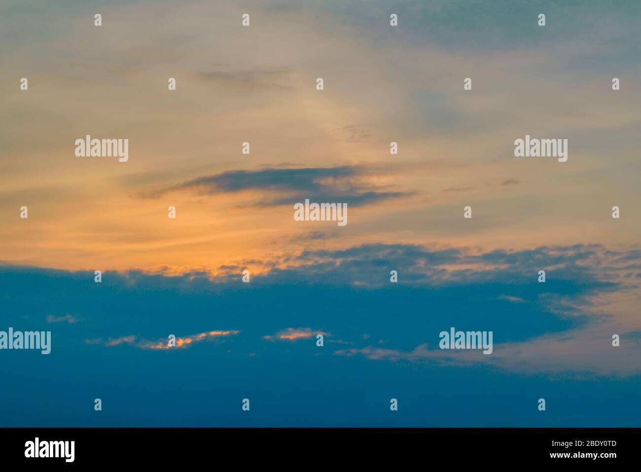 Spring evening sky in the picturesque clouds, lit by the rays of the ...