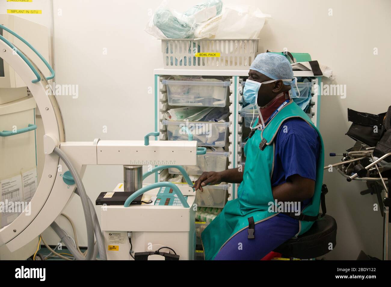 An Anaesthetist checks equipment and monitors the patients progress in ...