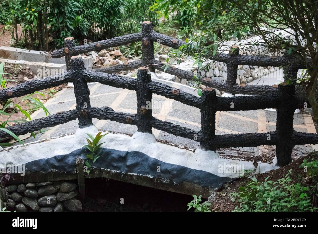 Small concrete bridge crossing a small river Stock Photo - Alamy