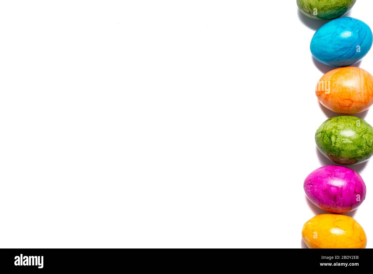 Border of easter eggs in different colors on the right isolated on ...