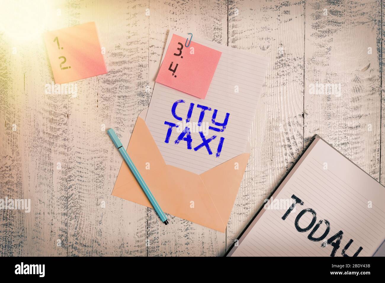Writing note showing City Taxi. Business concept for type of vehicle ...