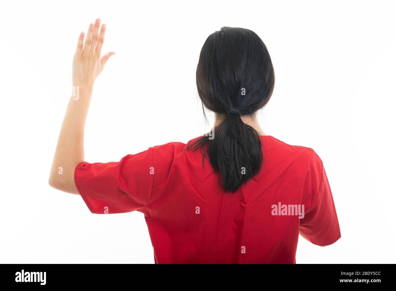 Back view of young attractive female nurse taking oath isolated on ...