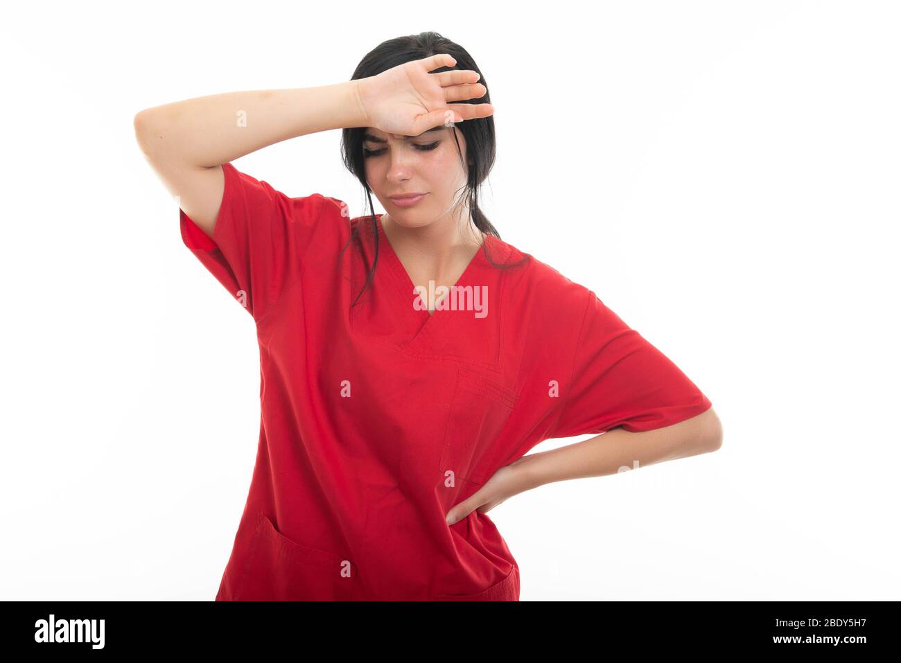 Portrait of young attractive female nurse making problem gesture ...
