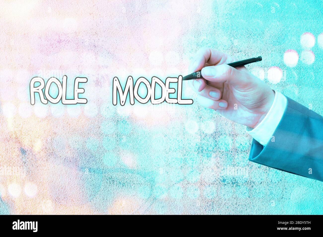 Conceptual hand writing showing Role Model. Concept meaning a ...
