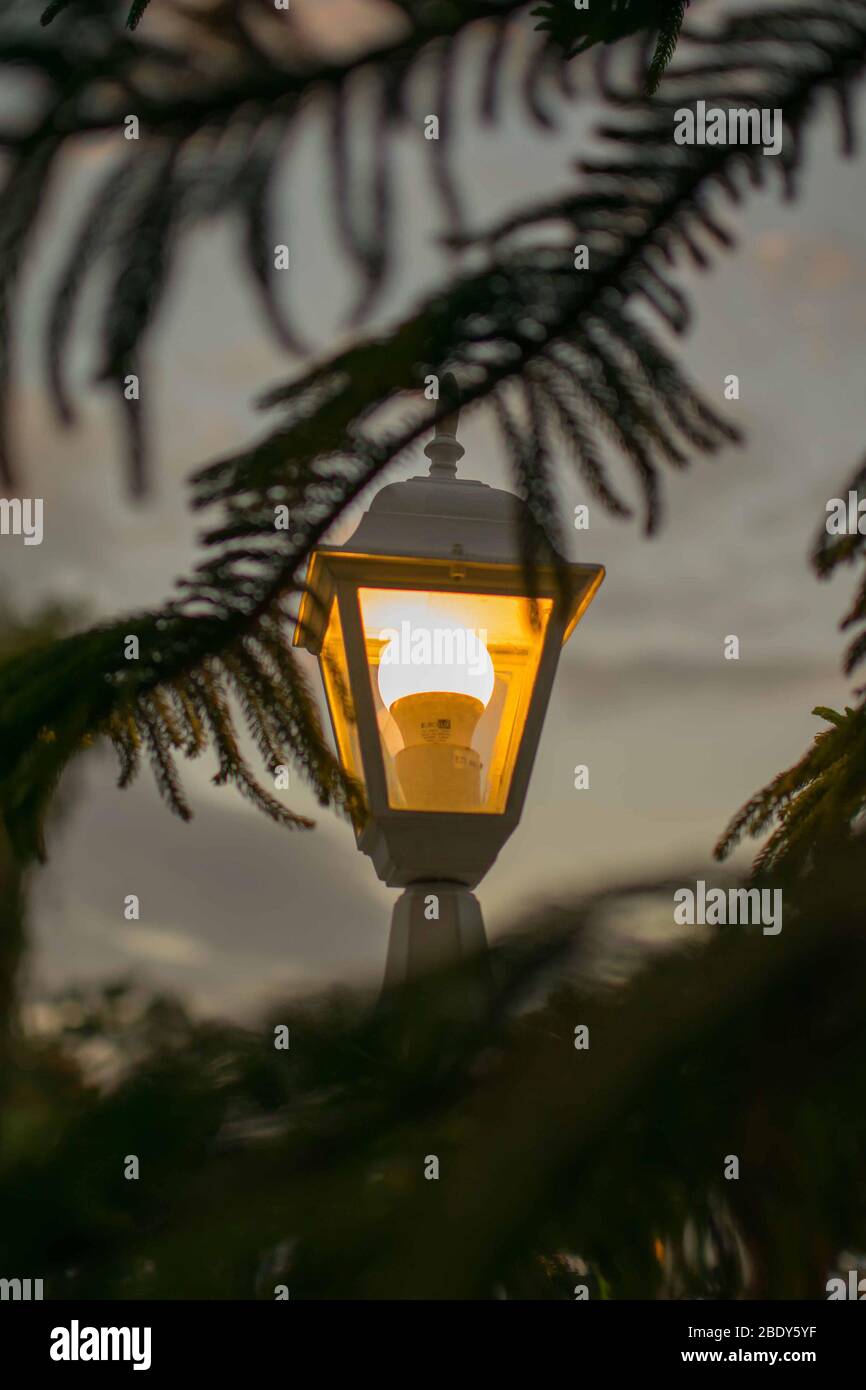 Lit traditional lamp post Stock Photo - Alamy