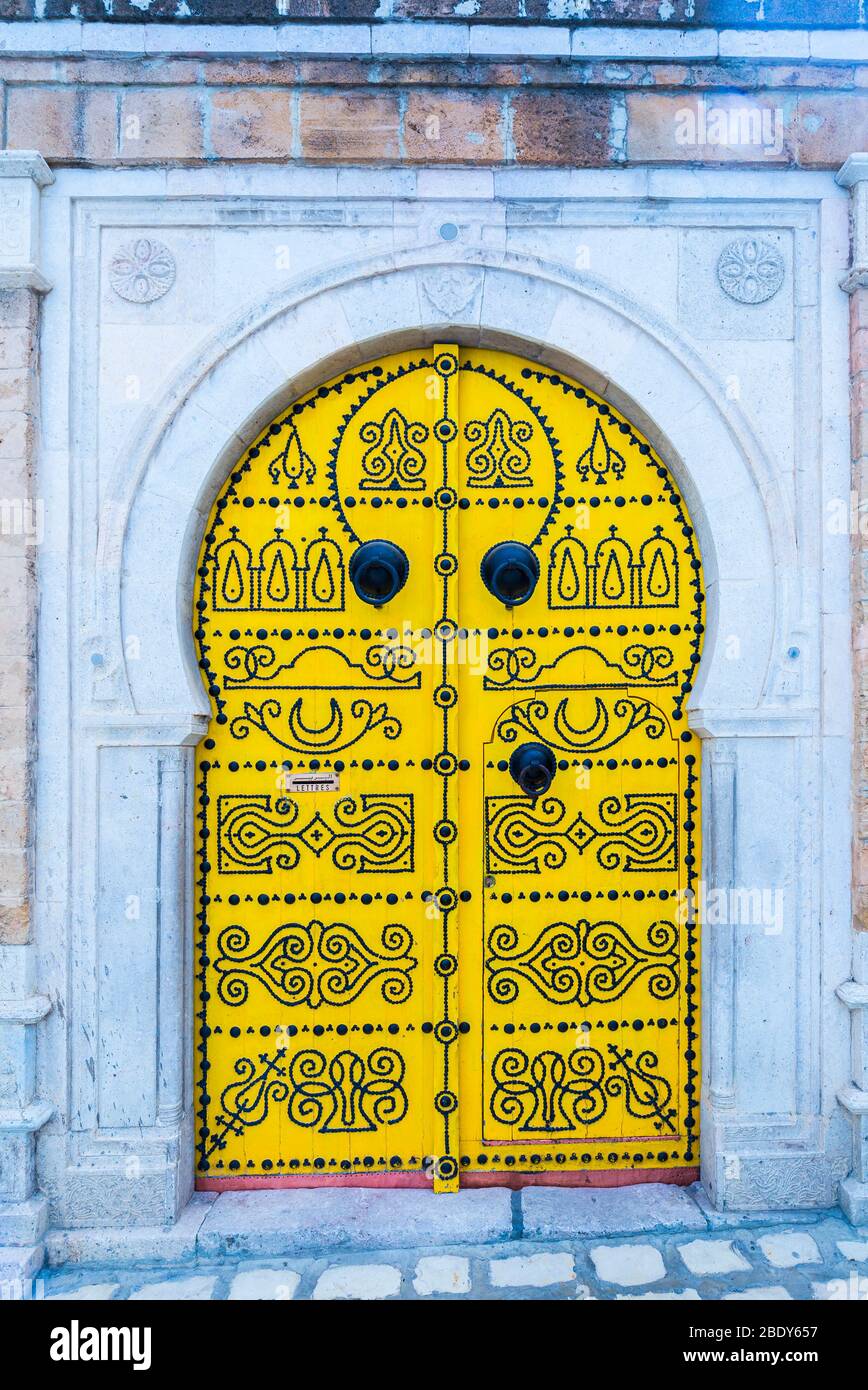 Spiked wooden door in the medina Stock Photo - Alamy