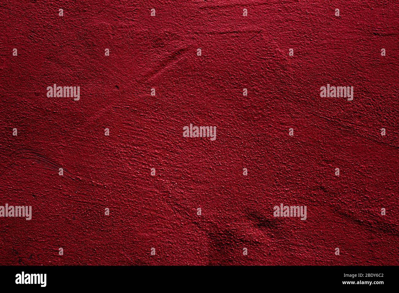 Crimson colored abstract wall background with textures of different ...