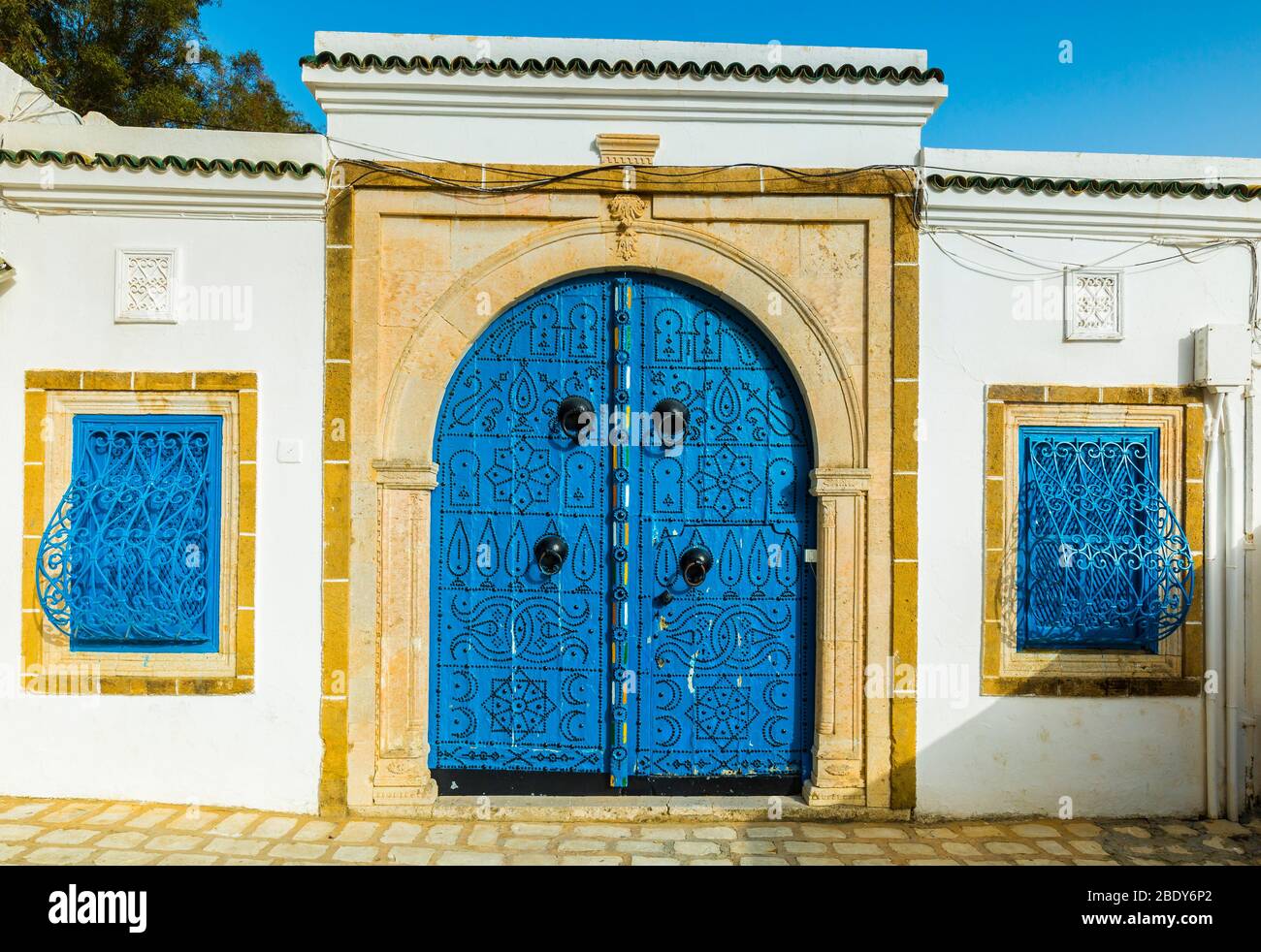 Spiked wooden door in the medina Stock Photo - Alamy