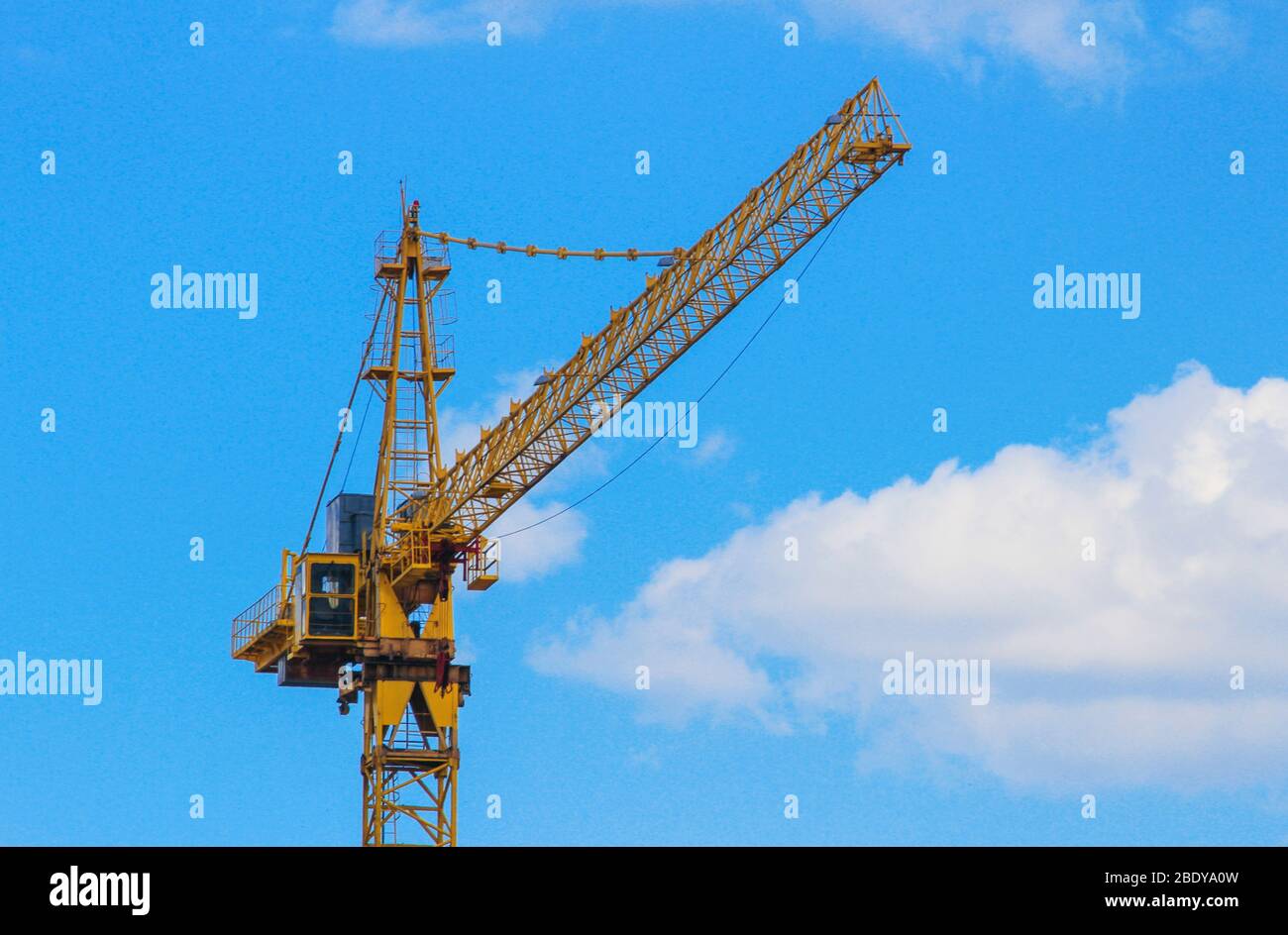 Arrow construction tower crane on a background of blue sky Stock Photo ...