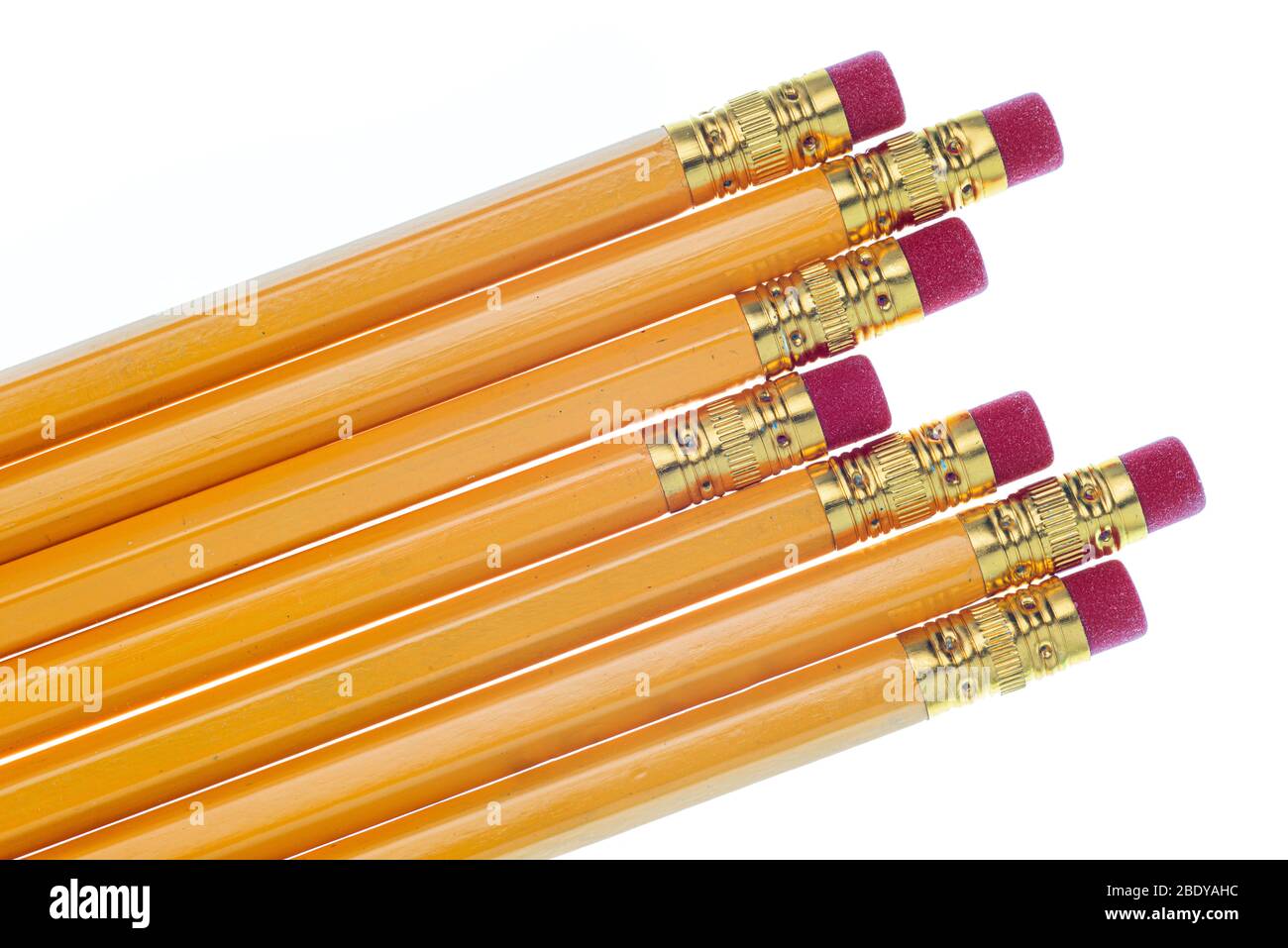 Horizontal close-up shot of the eraser ends of seven pencils laying on ...