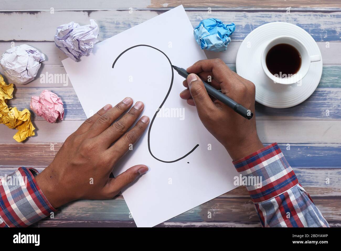 high angle view of man hand drawing question mark Stock Photo - Alamy