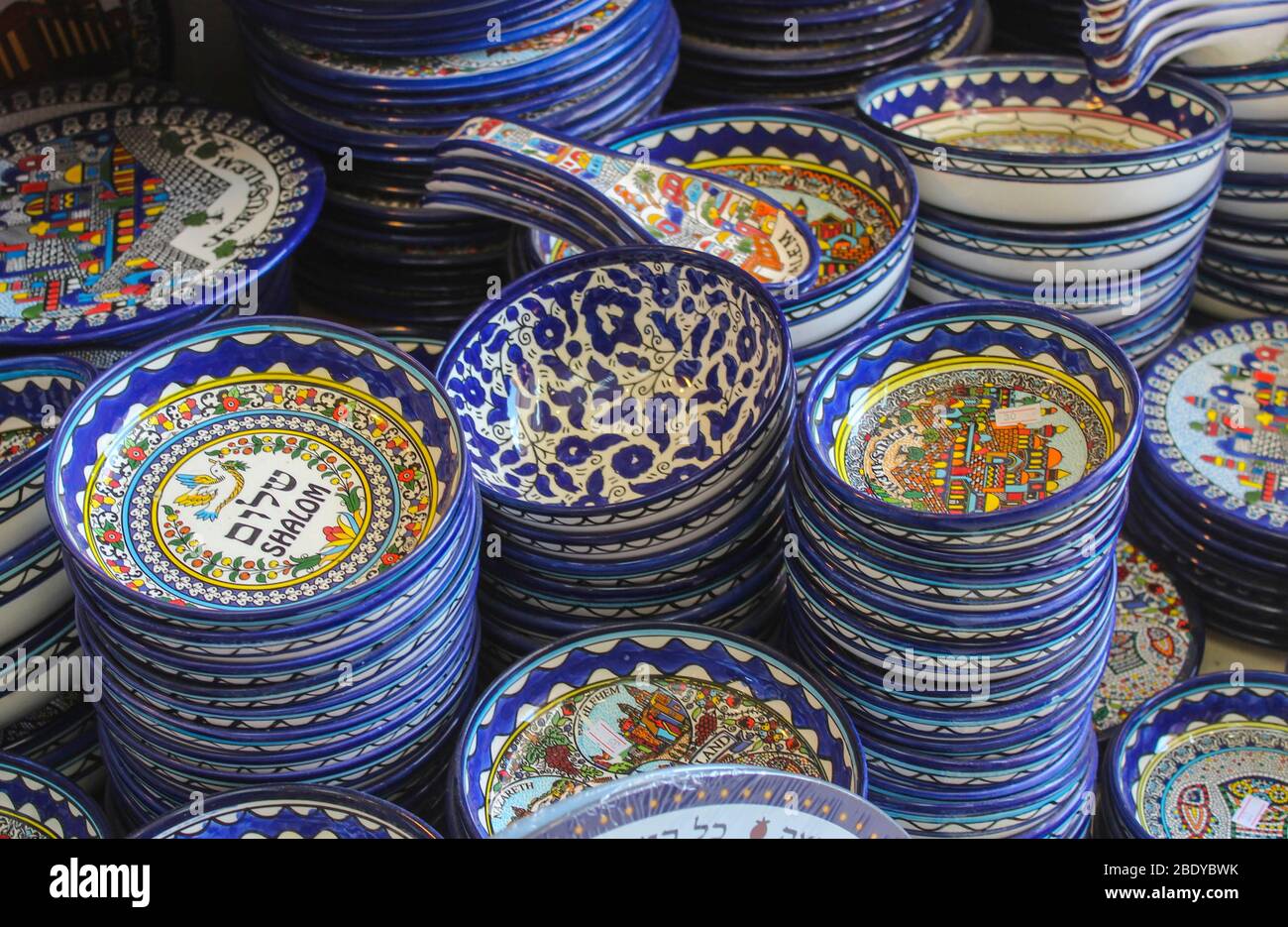 Piles of dishes with symbols of Israel in the souvenir shop Stock Photo ...
