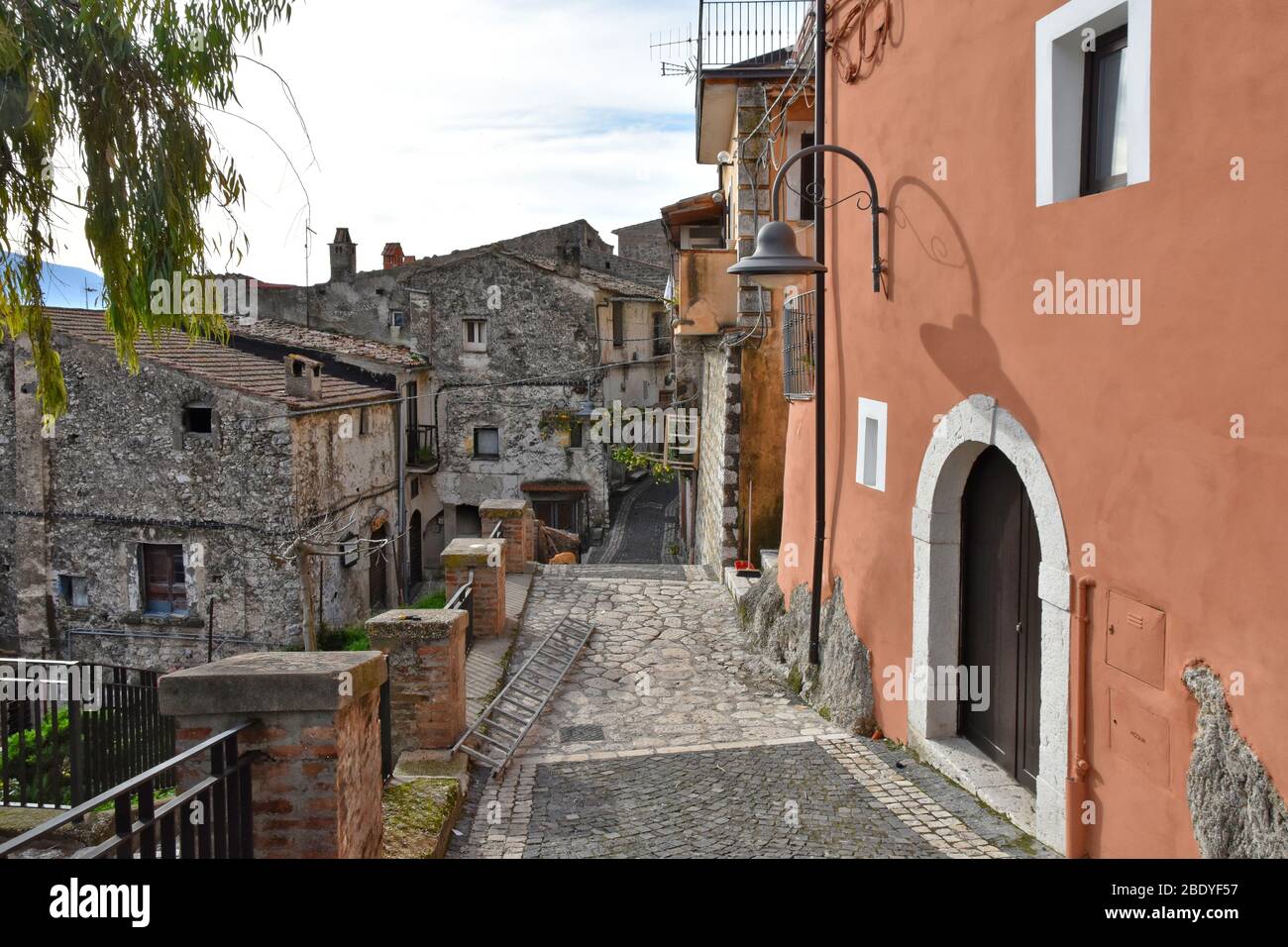A narrow street between the houses of Presenzano, a town in the ...