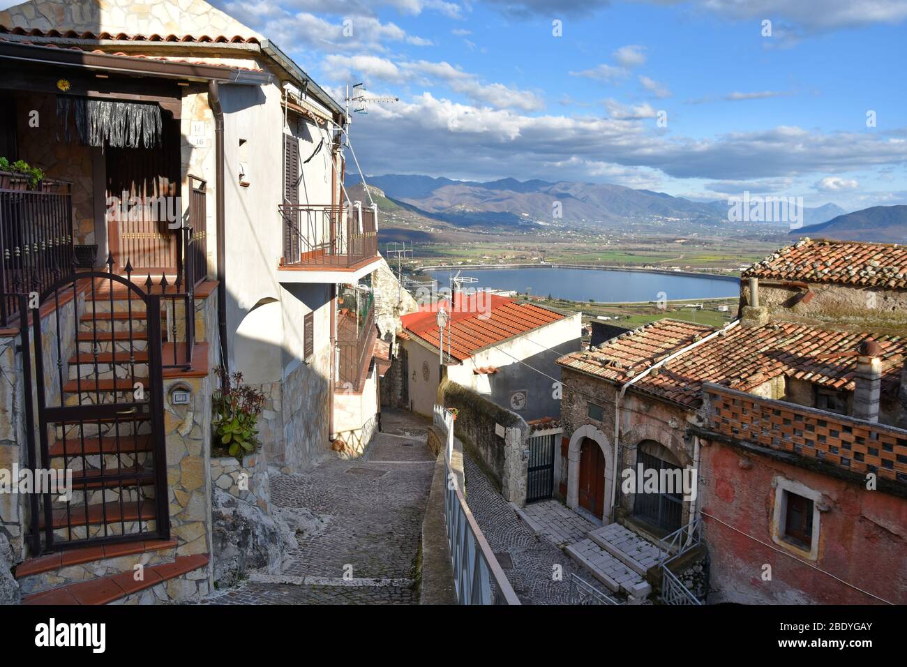 A narrow street between the houses of Presenzano, a town in the ...