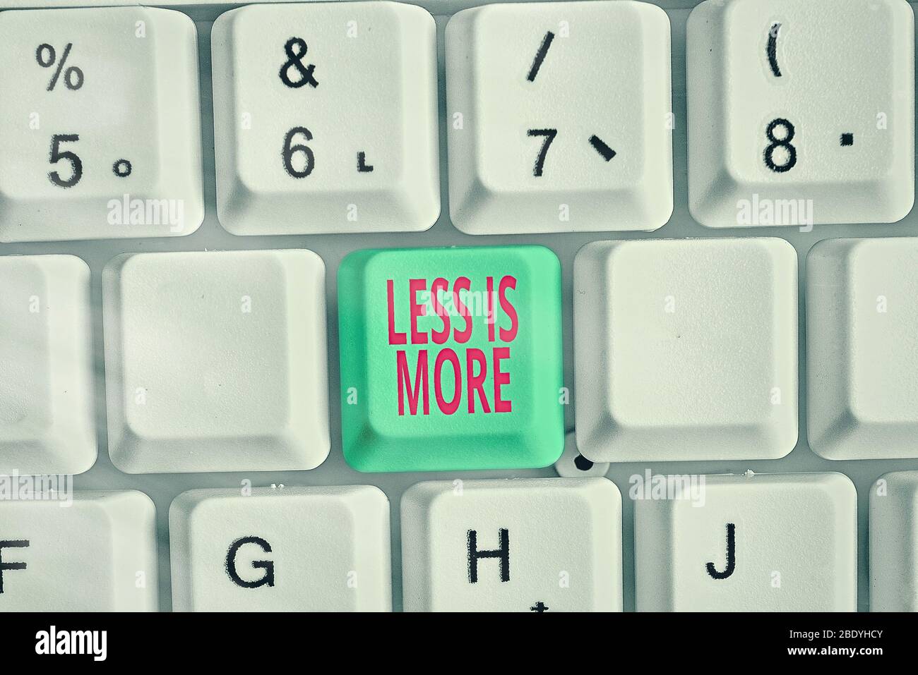 Writing note showing Less Is More. Business concept for used to express ...