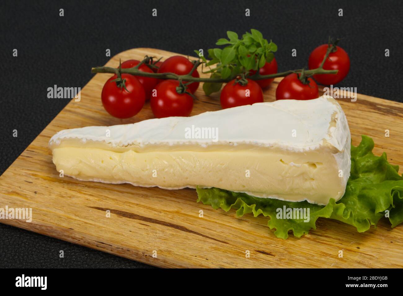Brie cheese triangle served salad leaves Stock Photo - Alamy