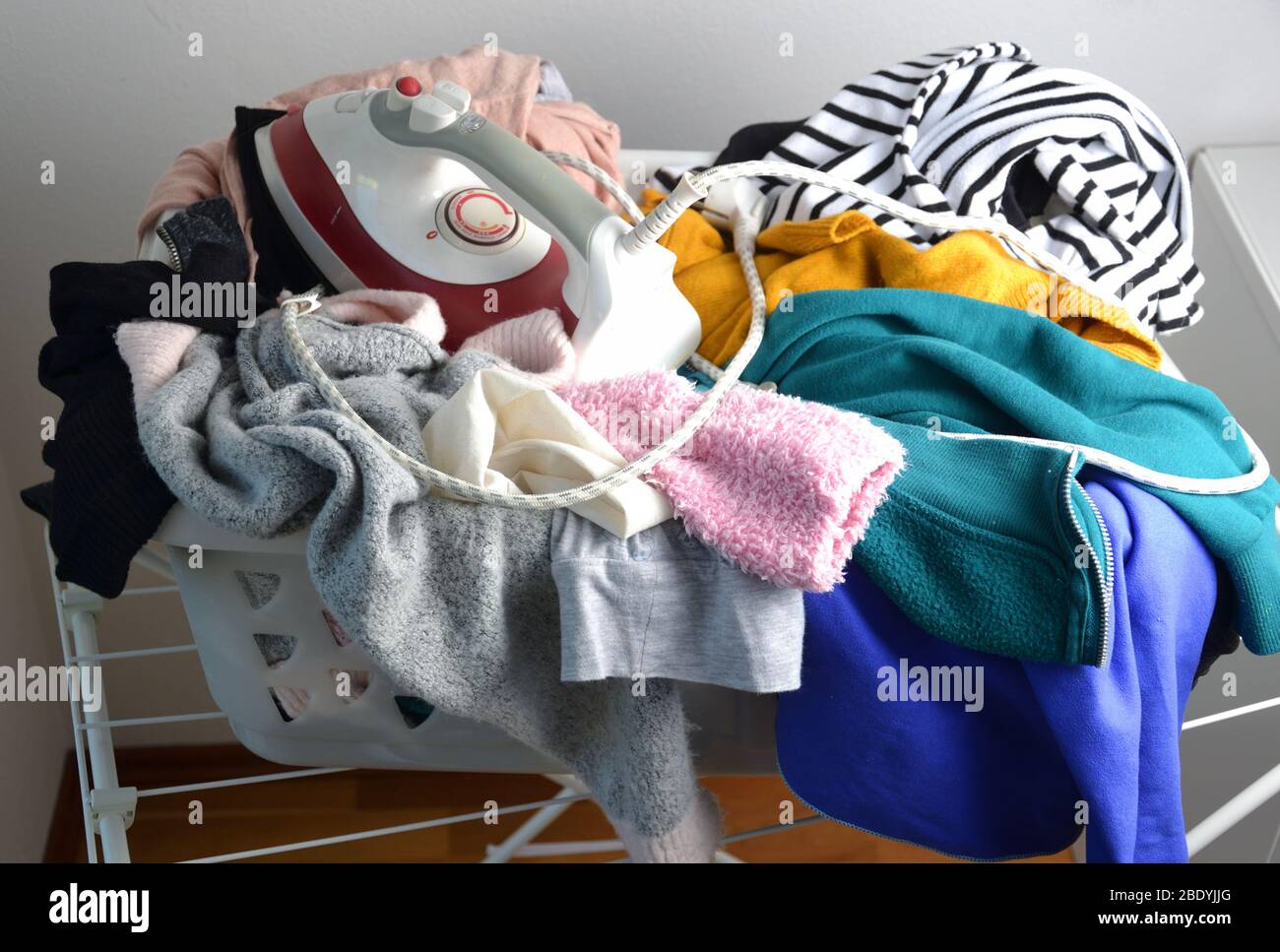Woman ironing a dress hi-res stock photography and images - Alamy
