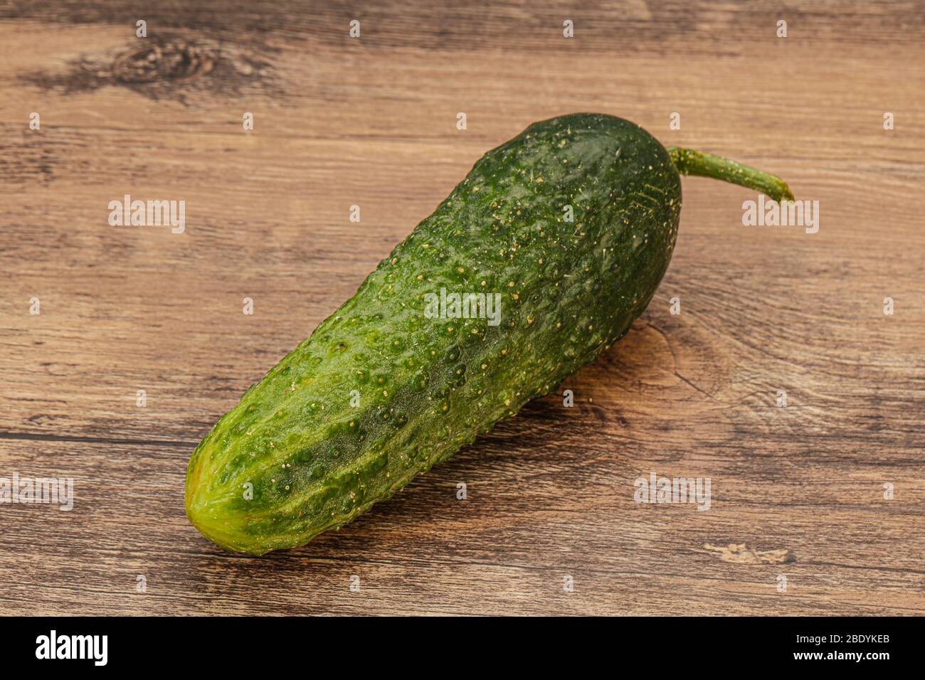 Green ripe fresh one cucumber over background Stock Photo - Alamy