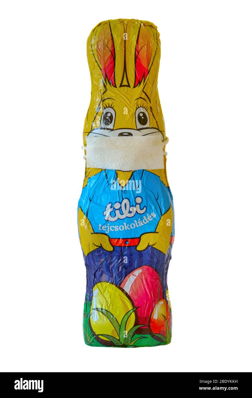 foil wrapped chocolate easter bunny rabbit wearing protective face mask ...
